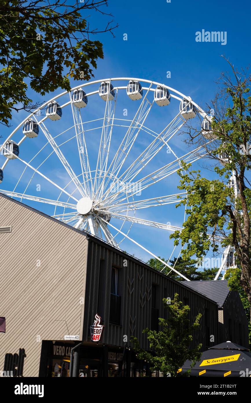 View of people enjoying their summer vacation along the promenade at ...