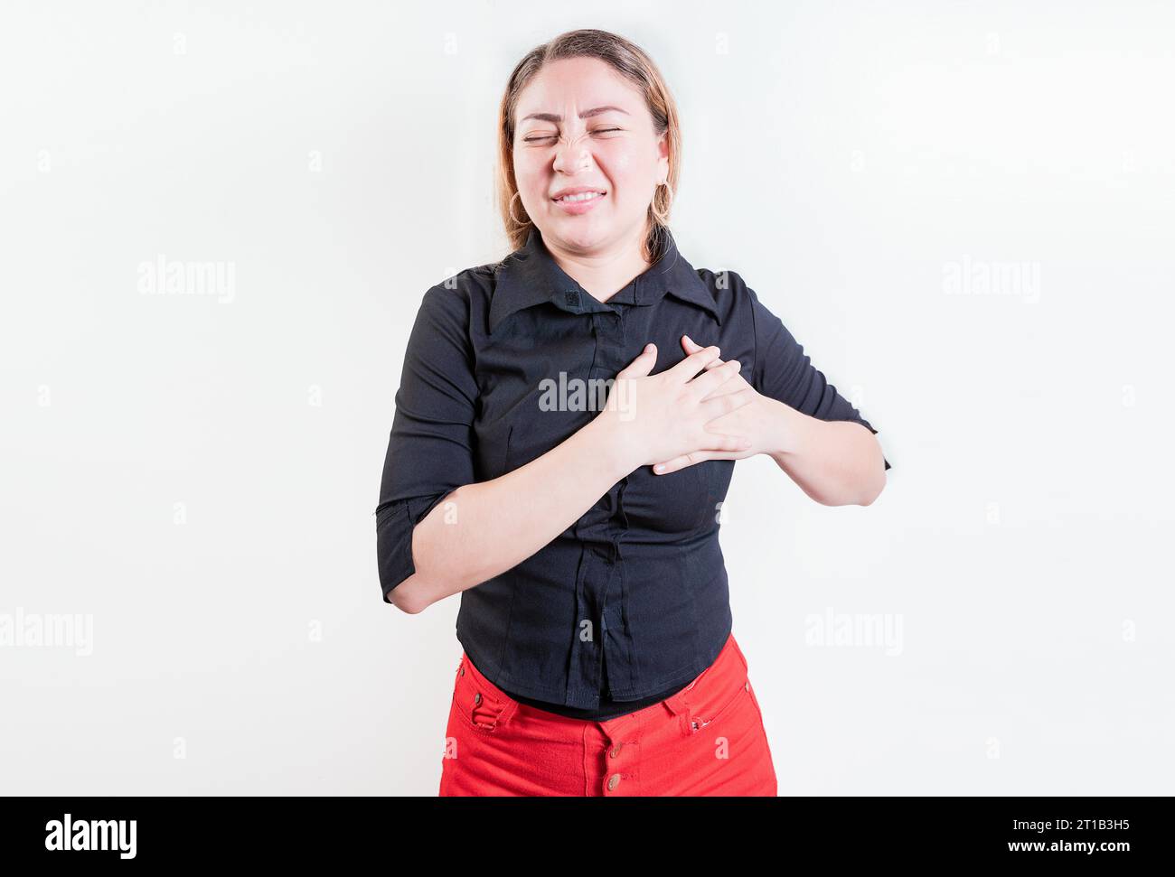 Latin woman with heart pain on isolated background. Young woman with ...