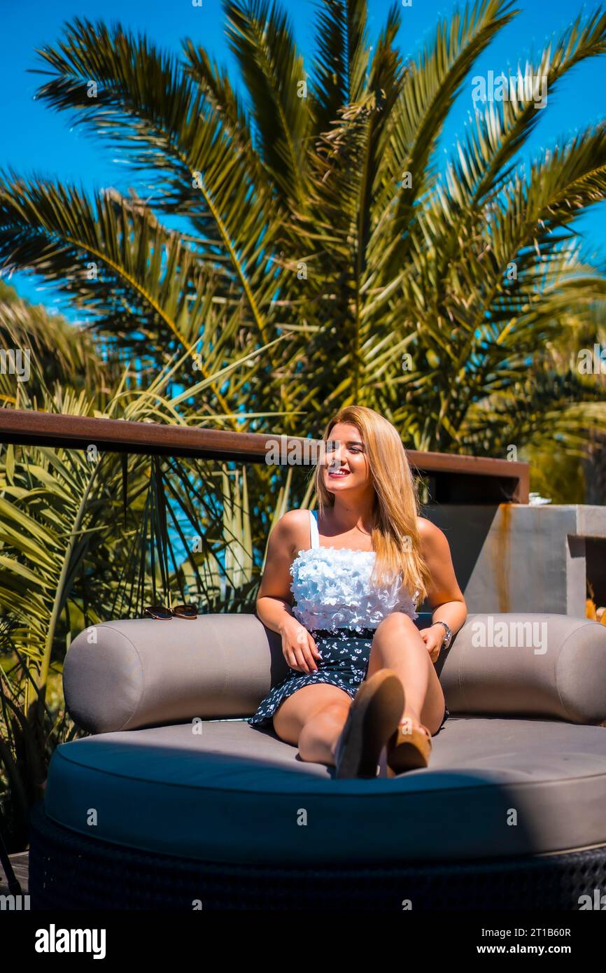 Blonde woman enjoying sunbathing in hi-res stock photography and images - Alamy