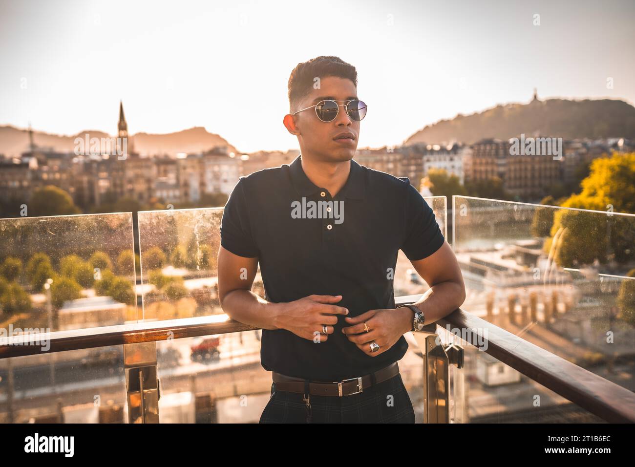 Fashion lifestyle, portrait of a young Latino with the city of San ...