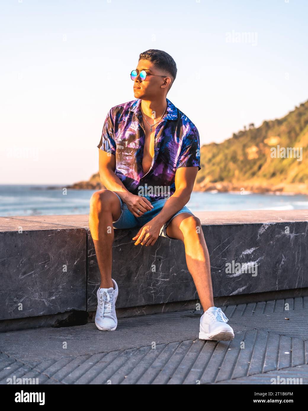 Summer lifestyle, portrait of a young Latino man enjoying summer ...