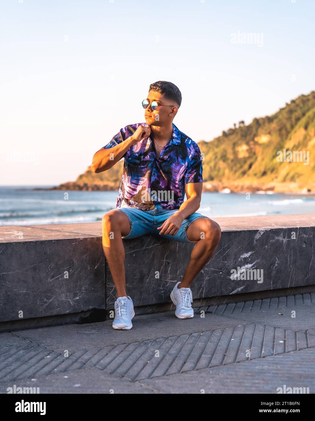 Summer lifestyle, portrait of a young Latino man enjoying summer ...