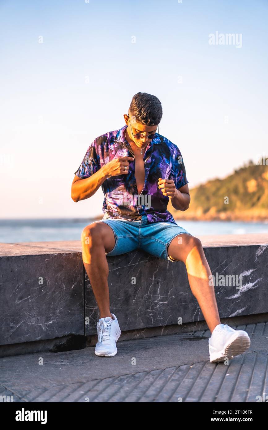 Summer lifestyle, portrait of a young Latino man enjoying summer ...