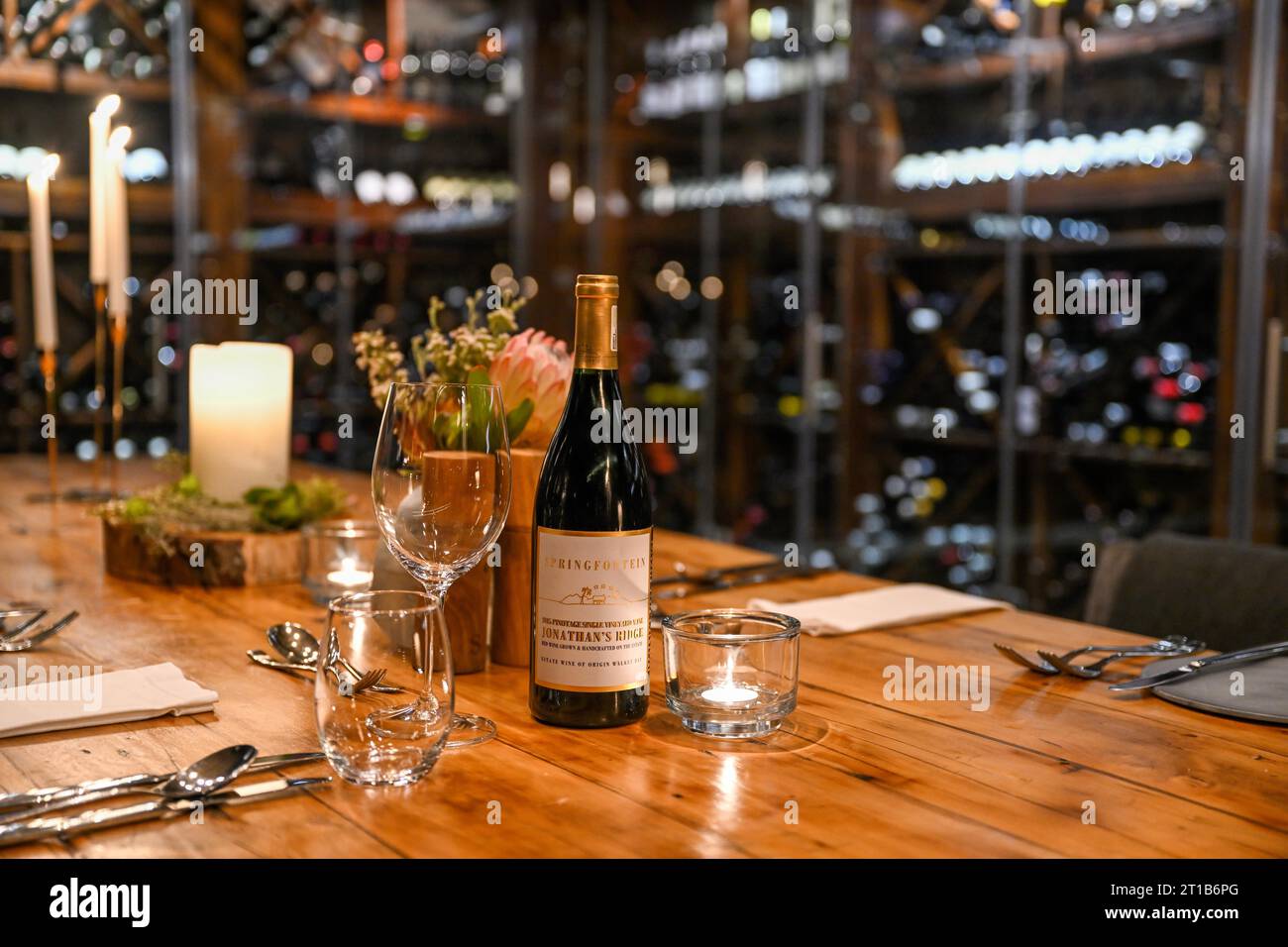 Table set in a wine cellar, interior shot, Gansbaai, Western Cape ...