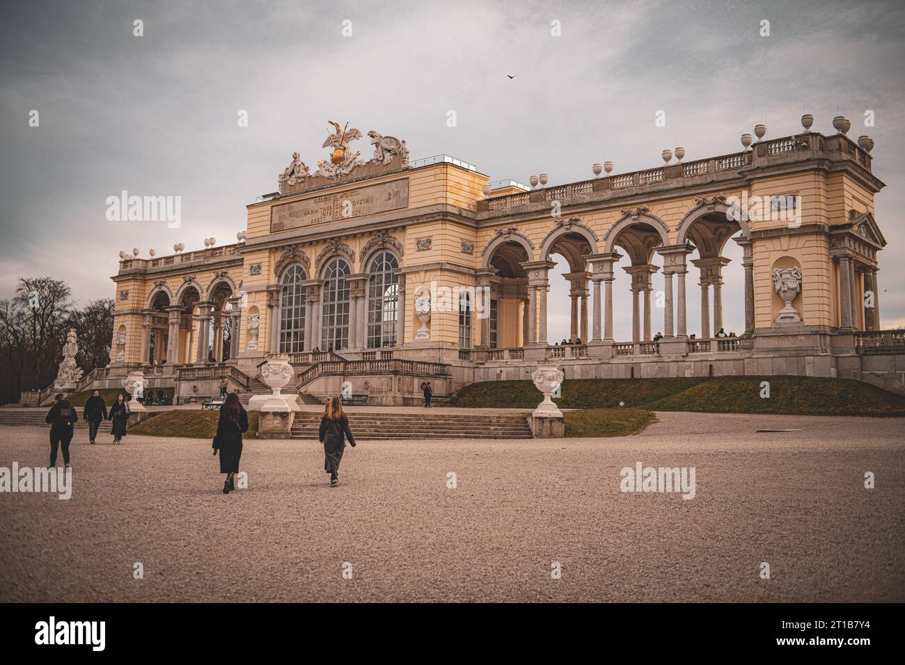 A group of tourists admire the beautiful Glorietta, in the Schonbrunn ...