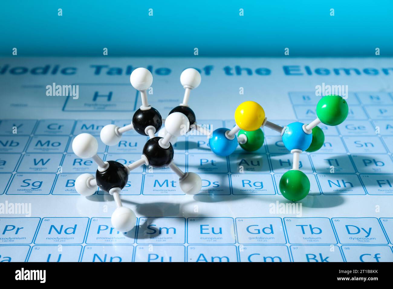 Molecular model on periodic table of chemical elements Stock Photo - Alamy