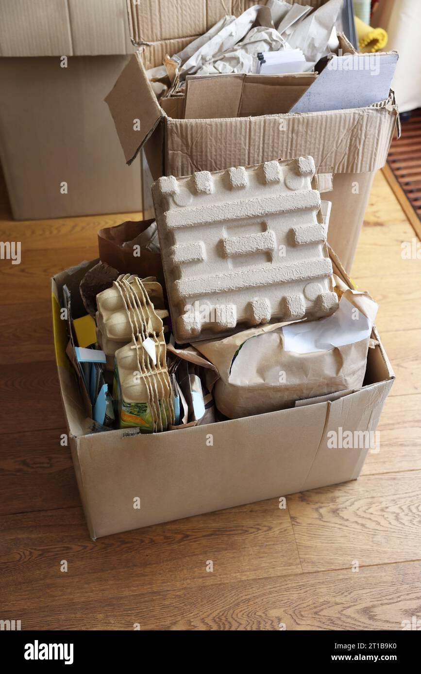 Reuse concept. Different trash in cardboard boxes for recycling on ...