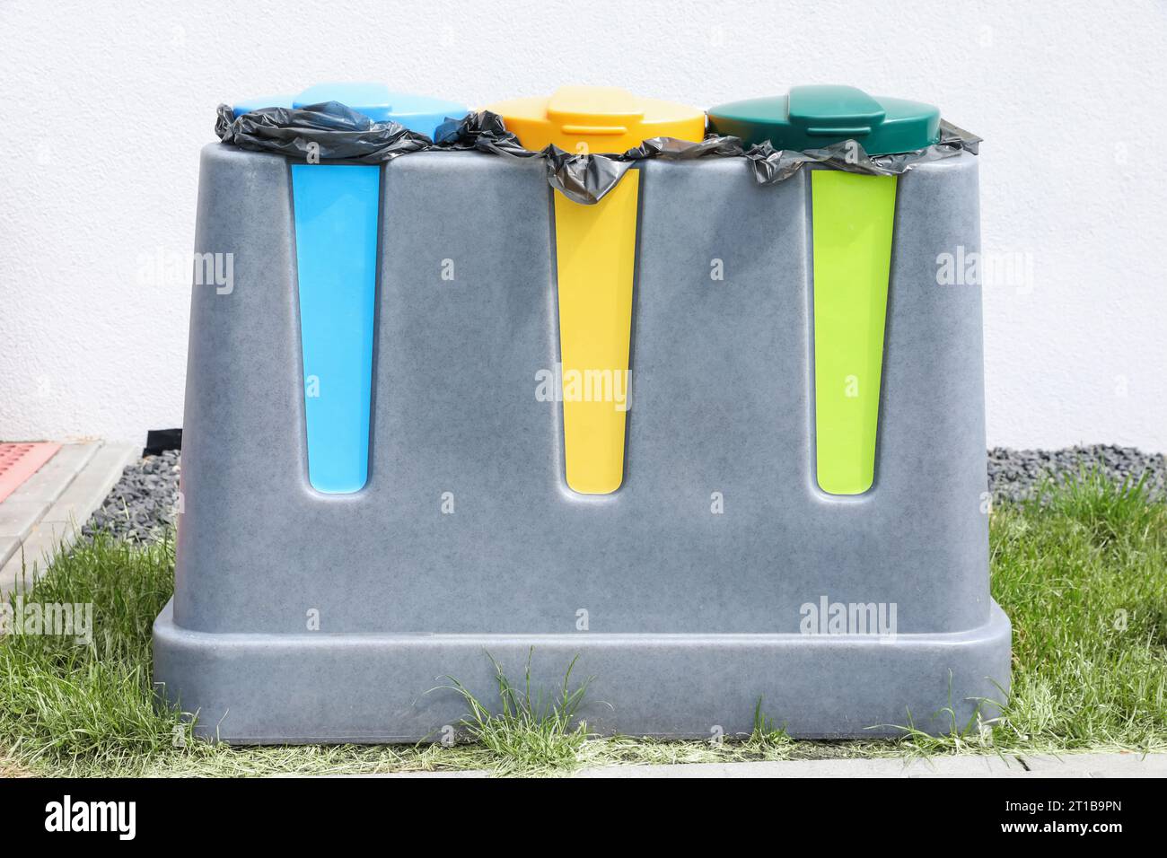 Recycling bins for different garbage outdoors. Waste sorting Stock ...