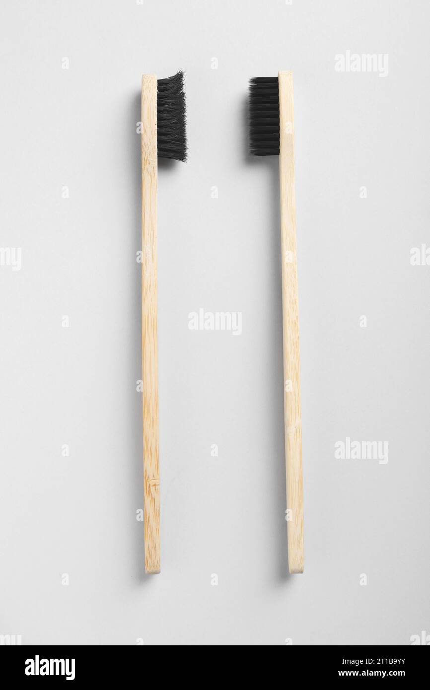 Old and new bamboo toothbrushes on white background, flat lay Stock ...