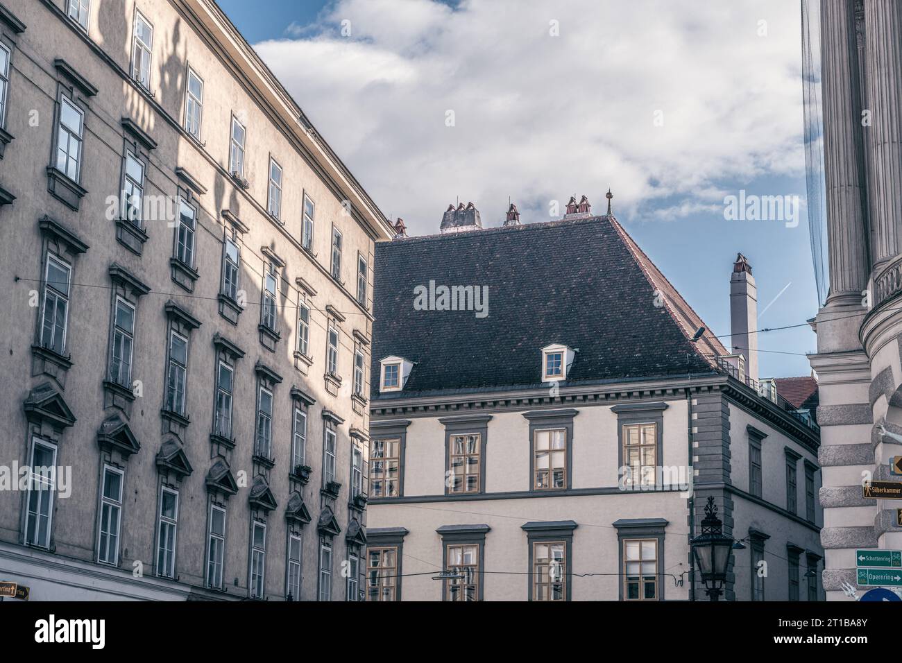 A bustling urban street with white buildings in Vienna, Austria Stock ...
