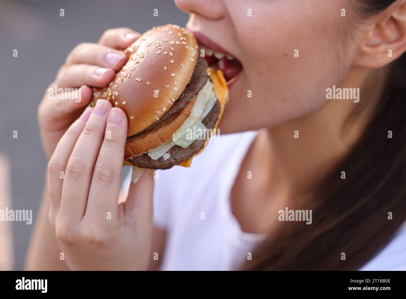 Lviv, Ukraine - September 26, 2023: Woman eating McDonald's burger ...