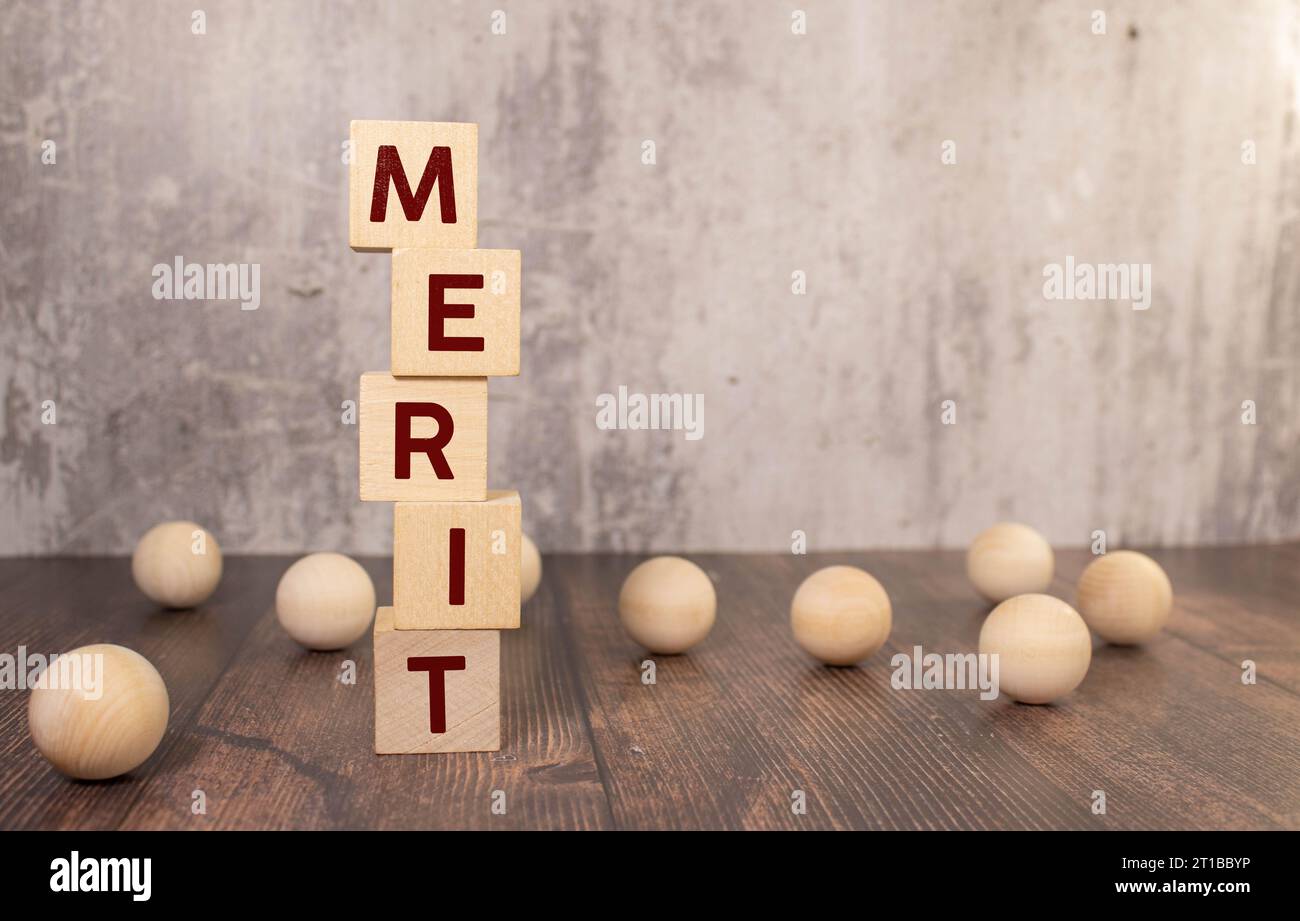 Merit symbol. Wooden circles with the word 'merit'. Beautiful white ...