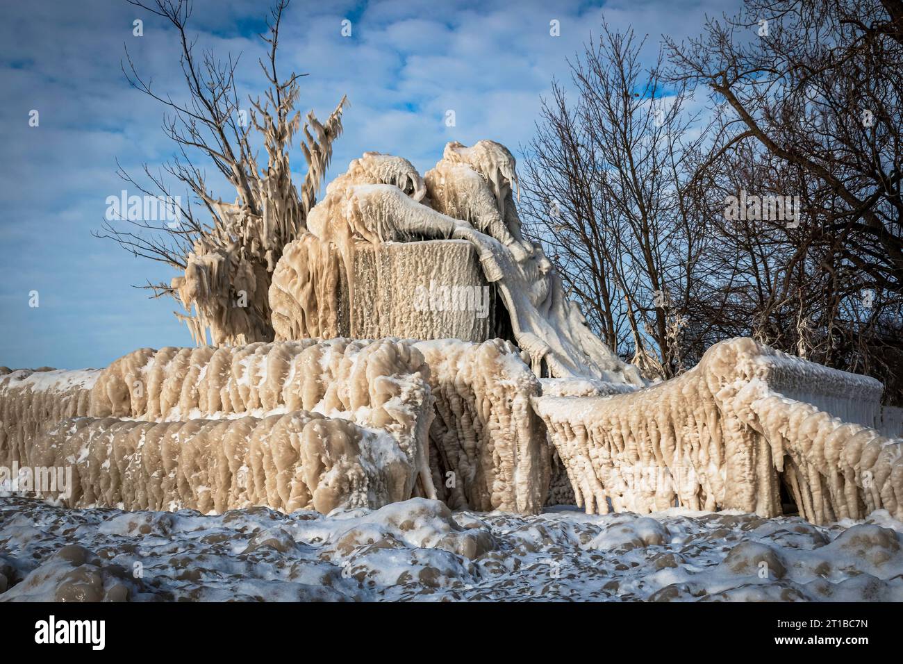 thick Ice formations over the monument after ice winter storm on the lake, winter wonderland ...