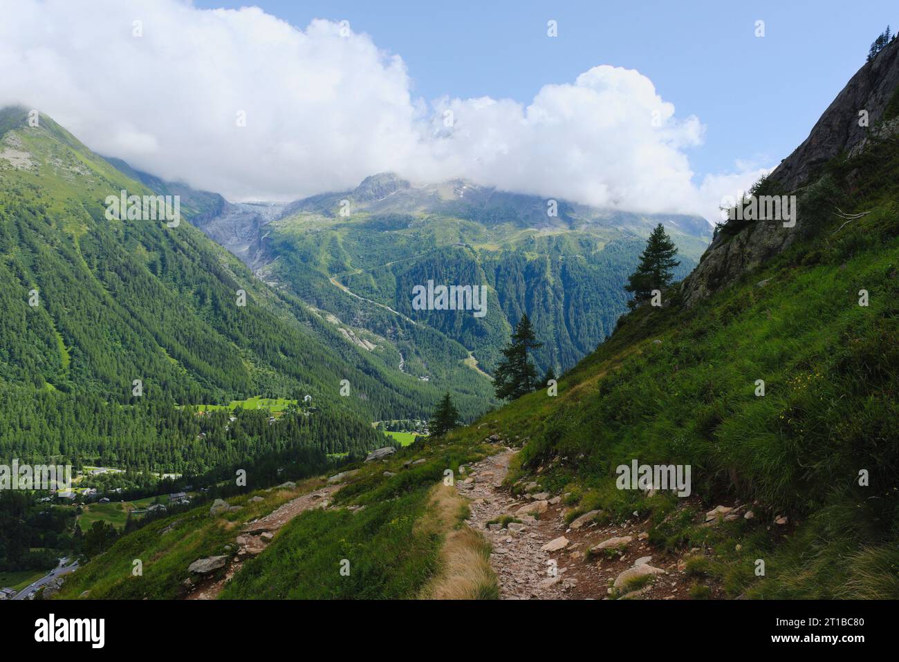Green mountain scenery in the french alps from a hiking trail, with a ...