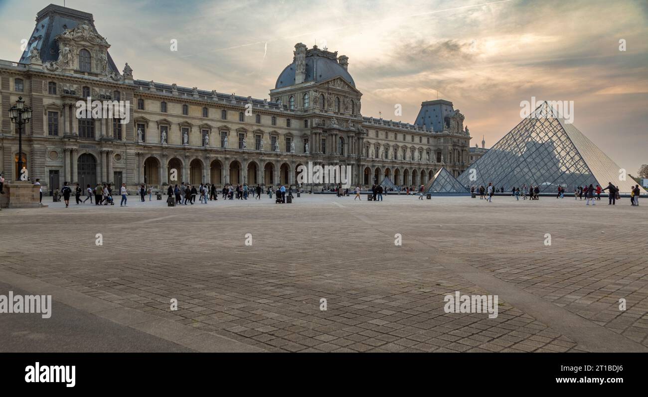 Courtyard and glass pyramid of the Louvre Museum at dusk, Paris, France ...