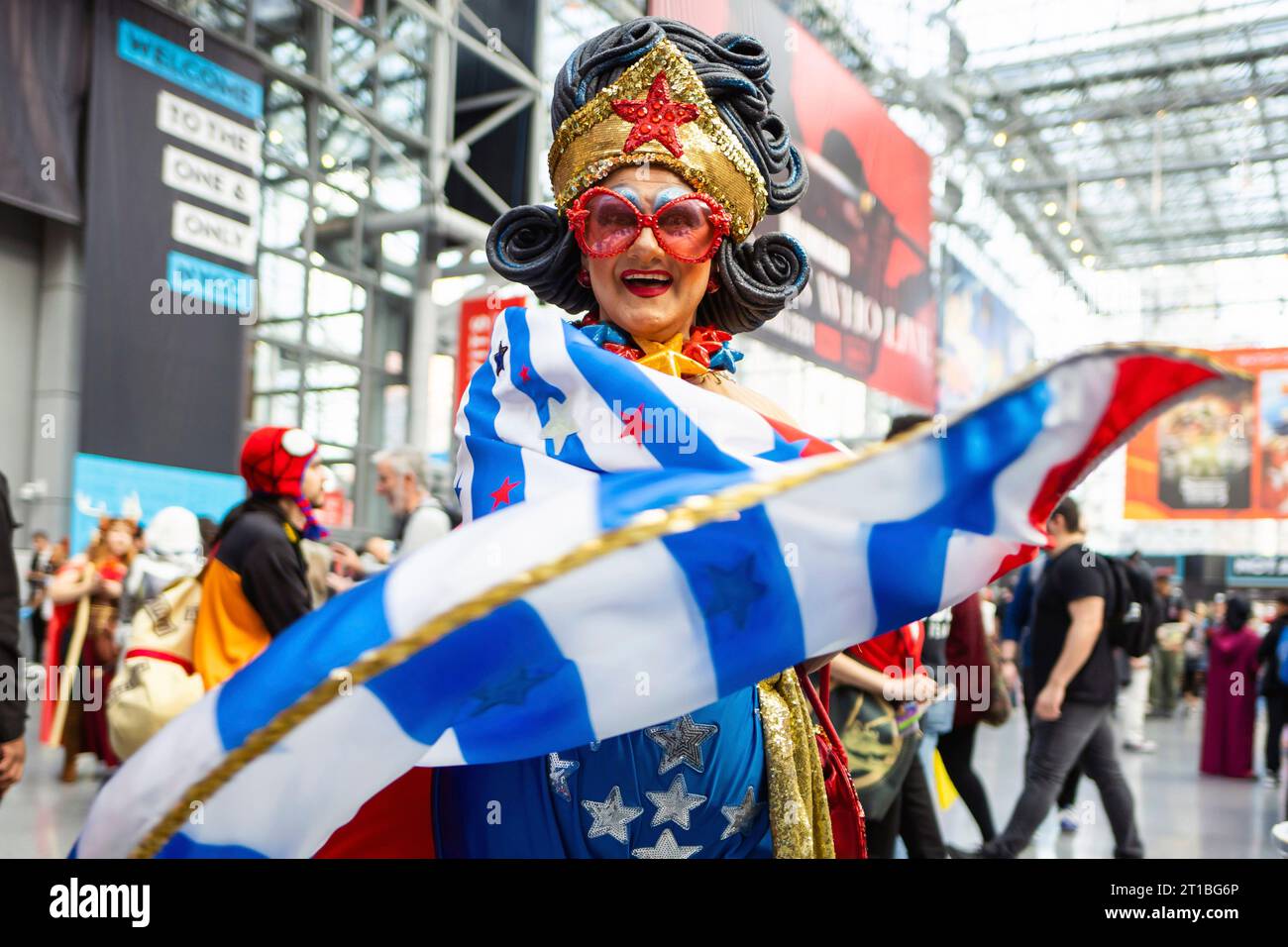 An attendee dressed as Wonder Woman poses during New York Comic Con at ...