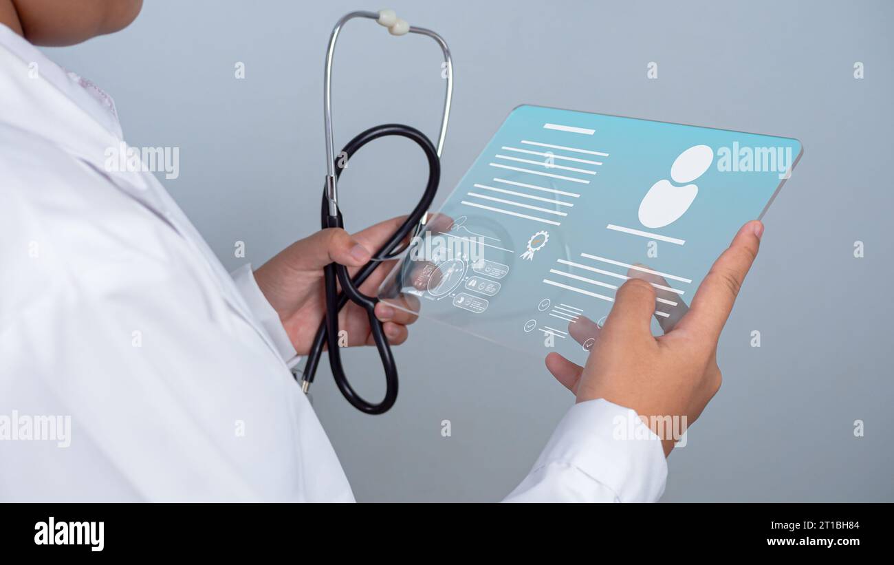 The doctor signs a document approving the patient's treatment. medical ...