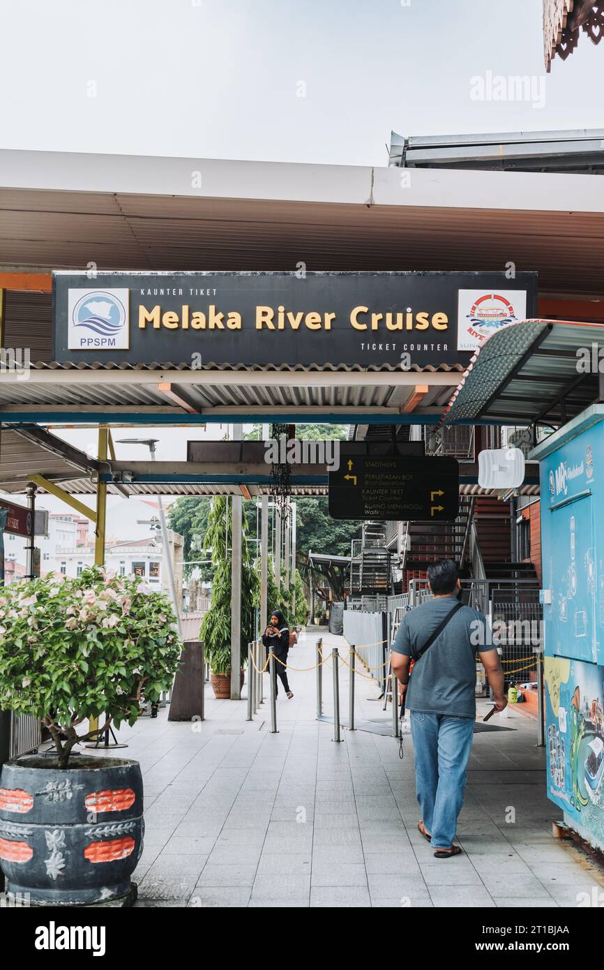 Melaka, Malaysia - July 9, 2023 Malacca river cruise enterance with tourist walking.. UNESCO ...