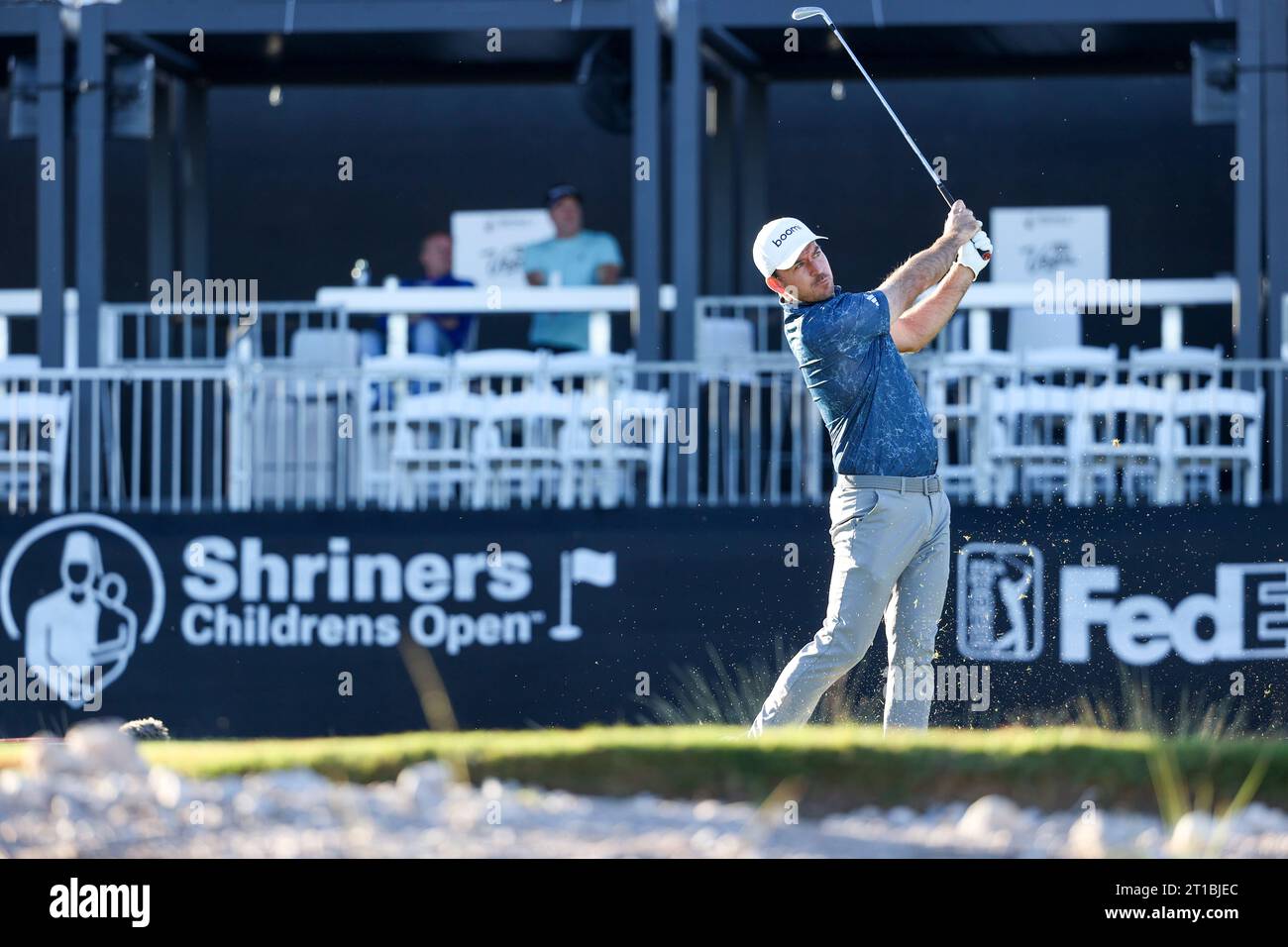 Nick Taylor, of Canada, follows through with tee shot on the 17th hole ...