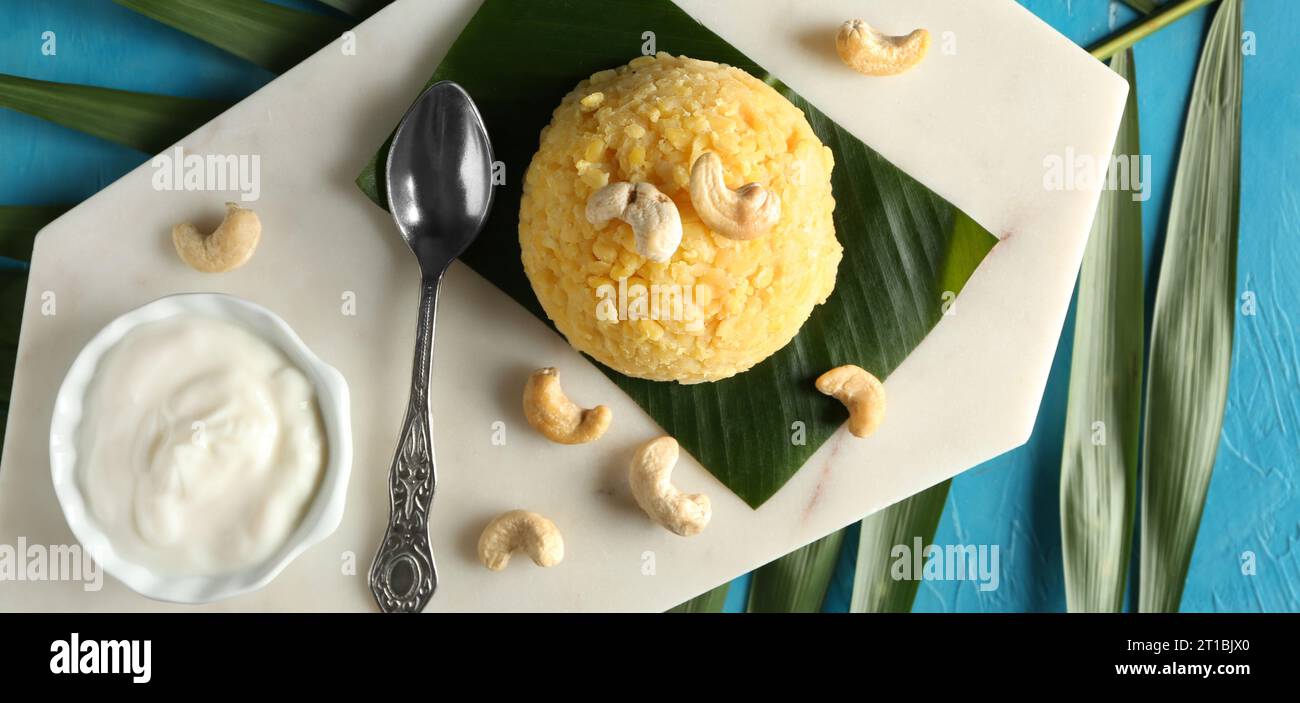 Board with traditional Indian food pongal on table, top view Stock ...