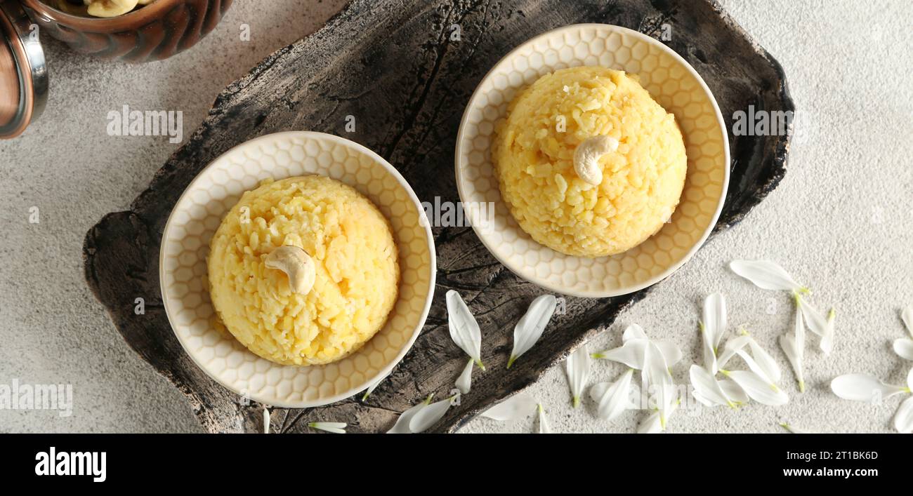 Bowls with traditional Indian food pongal on table, top view Stock ...