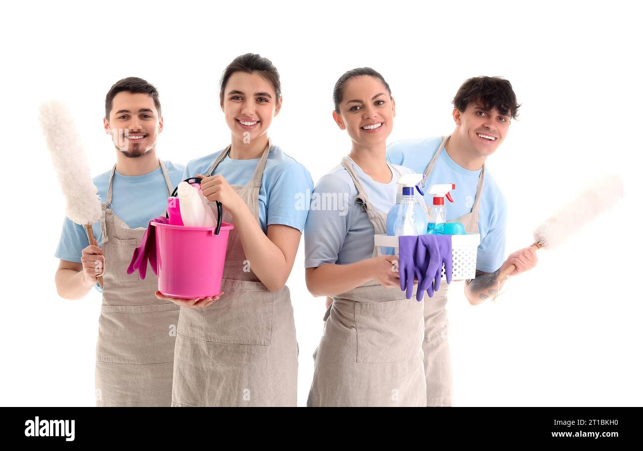 Young janitors with cleaning supplies on white background Stock Photo ...