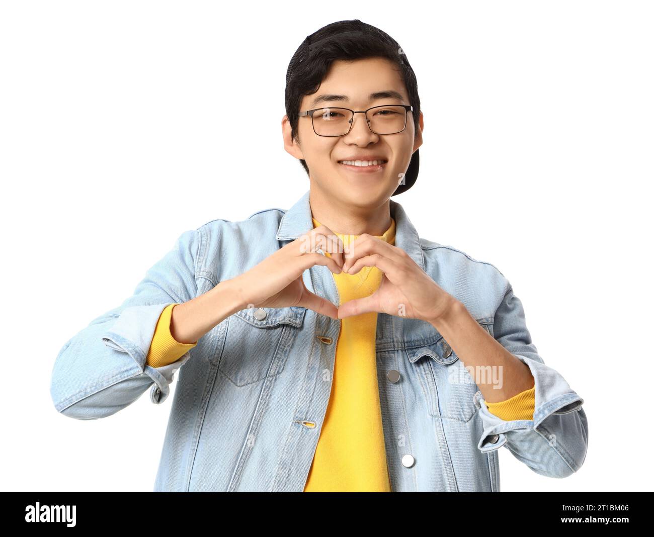 Young Asian man making heart gesture on white background Stock Photo ...