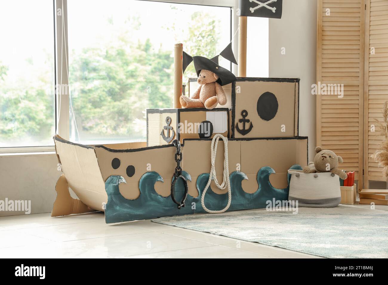 Pirate cardboard ship near window in children's room Stock Photo - Alamy