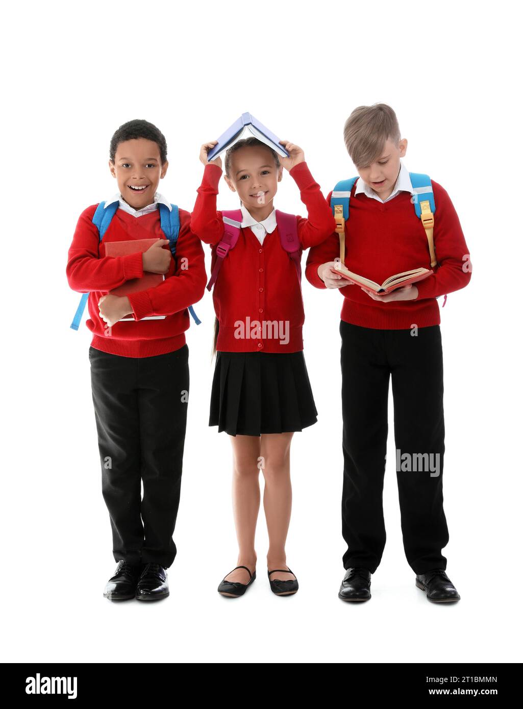 Little classmates in stylish uniform with backpacks and books isolated ...