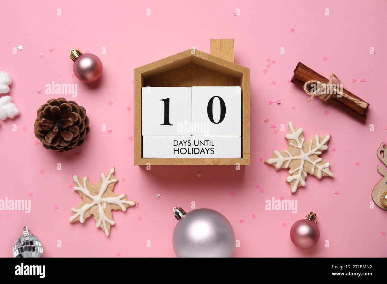 Calendar with text 10 DAYS UNTIL HOLIDAYS and Christmas decor on pink ...
