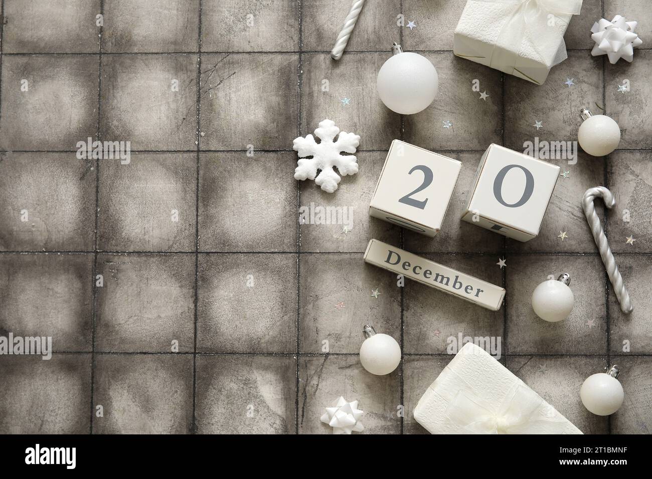 Composition with cube calendar, Christmas decorations and gift boxes on ...