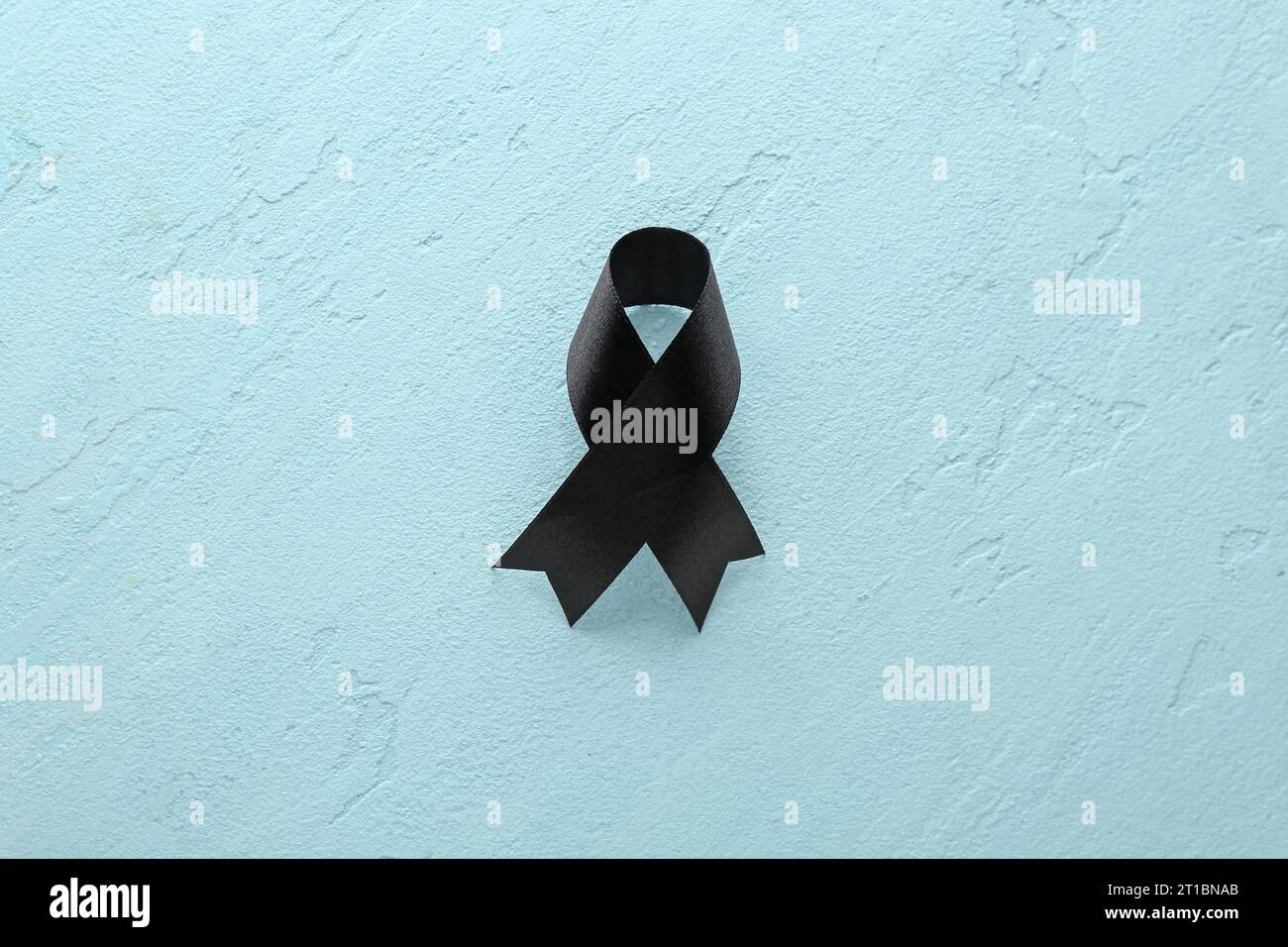 Black funeral ribbon on blue background Stock Photo - Alamy