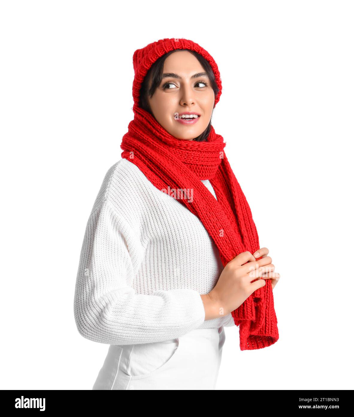 Young woman in warm clothes on white background Stock Photo - Alamy