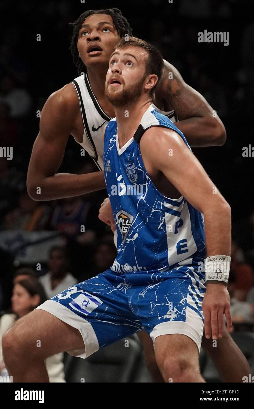 Brooklyn Nets' Noah Clowney, left, and Maccabi Ra'anana's Yoav Berman ...