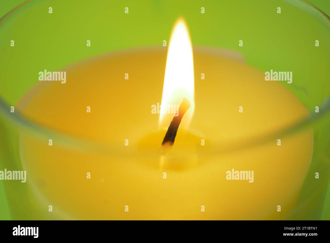 color candles slowly burning down in dark Stock Photo - Alamy