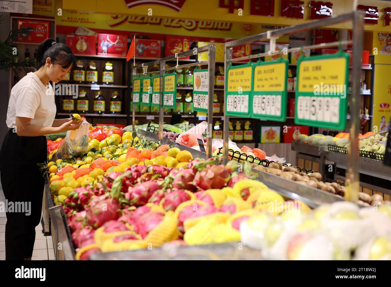 BINZHOU, CHINA - OCTOBER 13, 2023 - A consumer shops at a supermarket ...