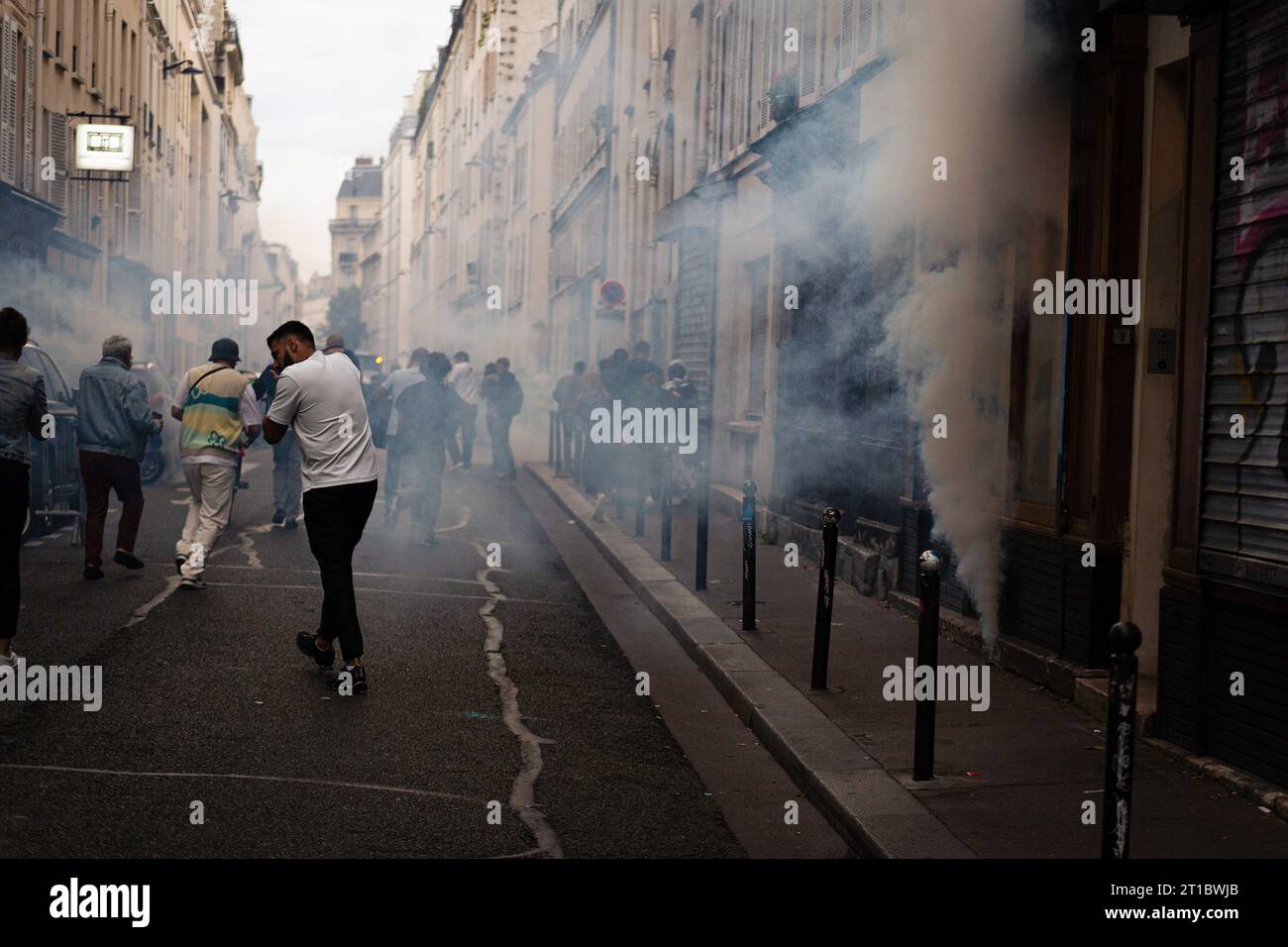 Paris, France. 12th Oct, 2023. People seen running from tear gas ...