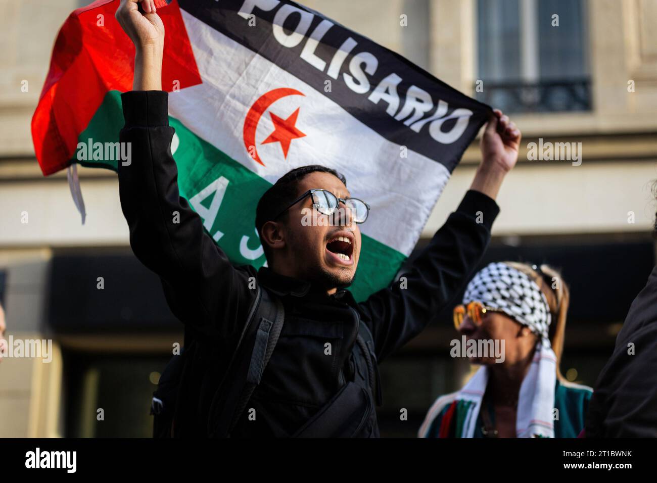 Paris, France. 12th Oct, 2023. A man holds a Palestine flag during the ...