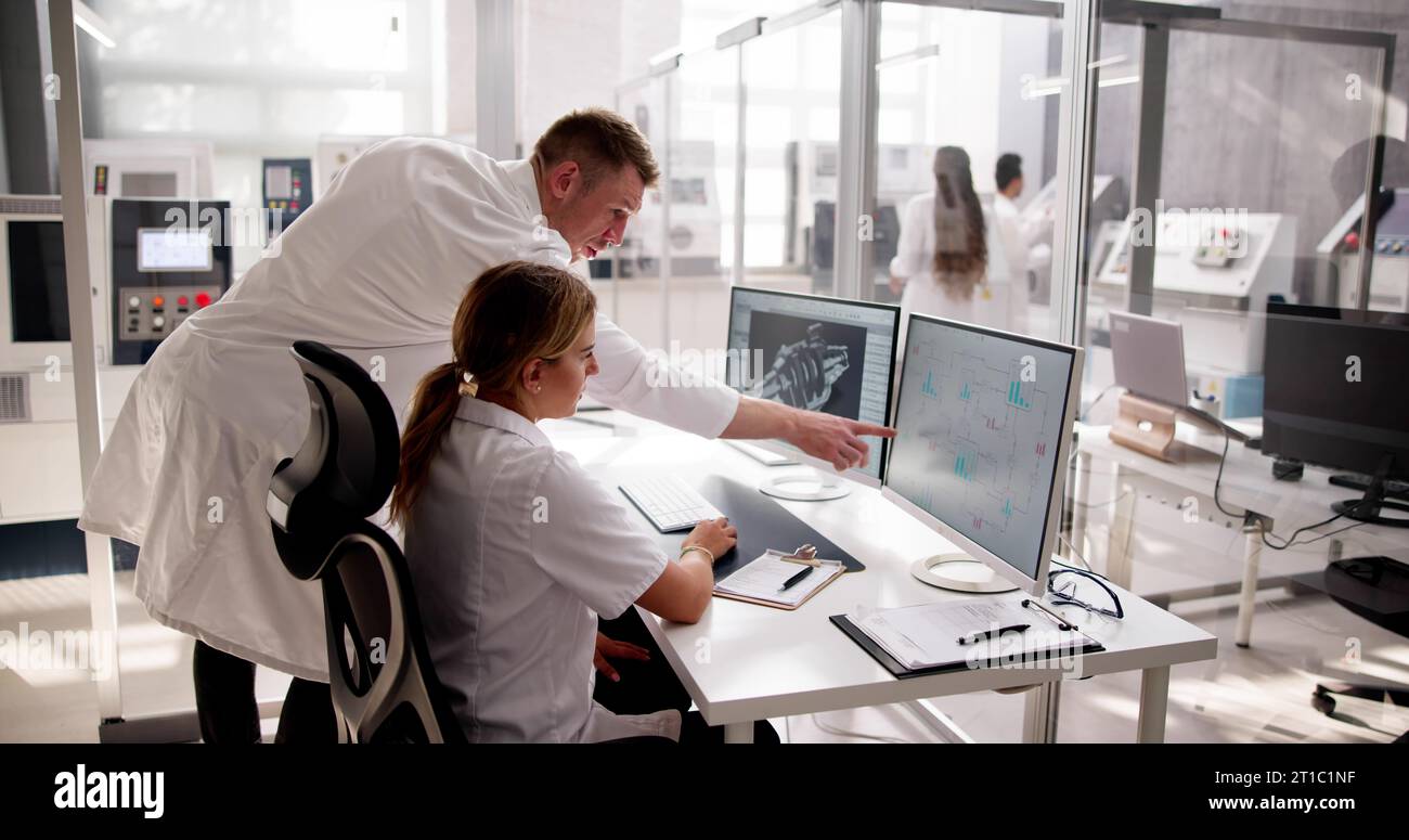 Engineer Doing 3D CAD Model Design On Computer At Factory Stock Photo ...