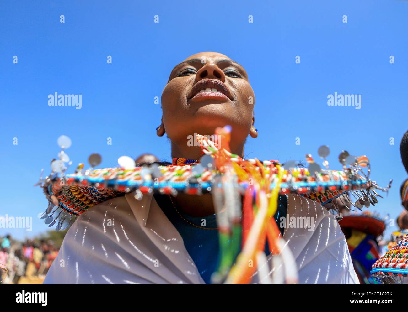 A woman dressed in traditional dress performs during the Maralal ...