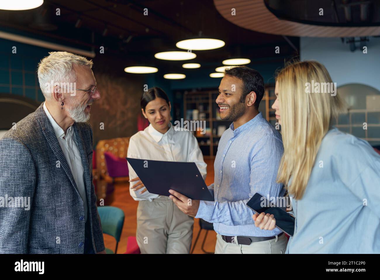 Group of people discussing documents project in the office. Business ...