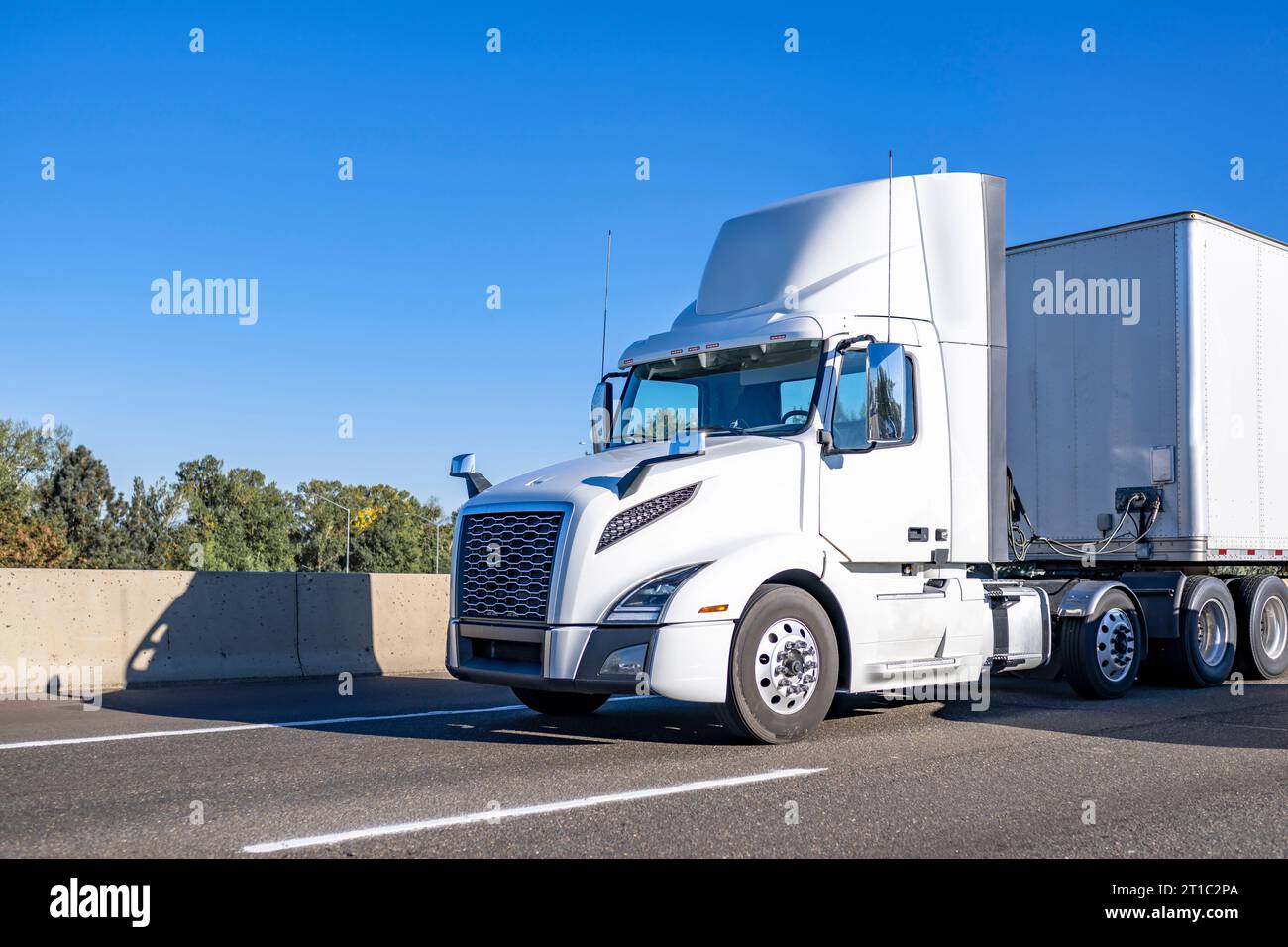 White classic industrial local carrier day cab big rig semi truck ...