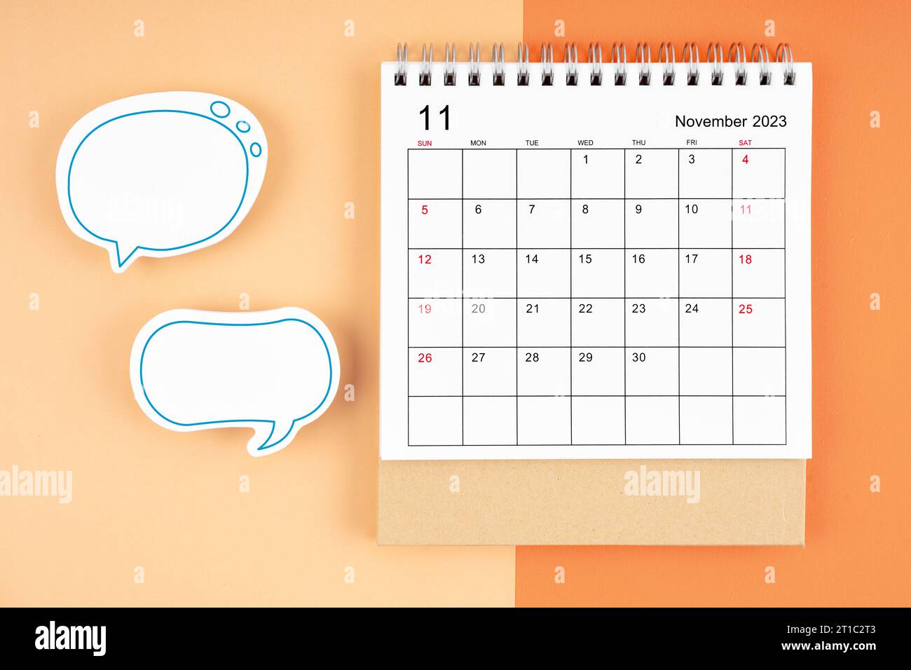 November 2023 desk calendar and empty speech bubble on beautiful ...