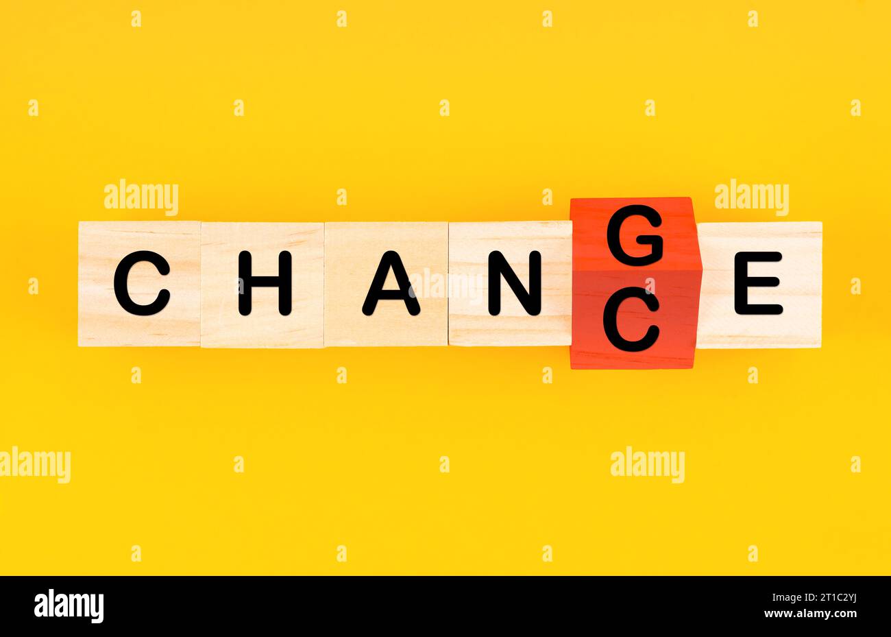Flipping wooden cube blocks with CHANGE to CHANCE text on yellow ...