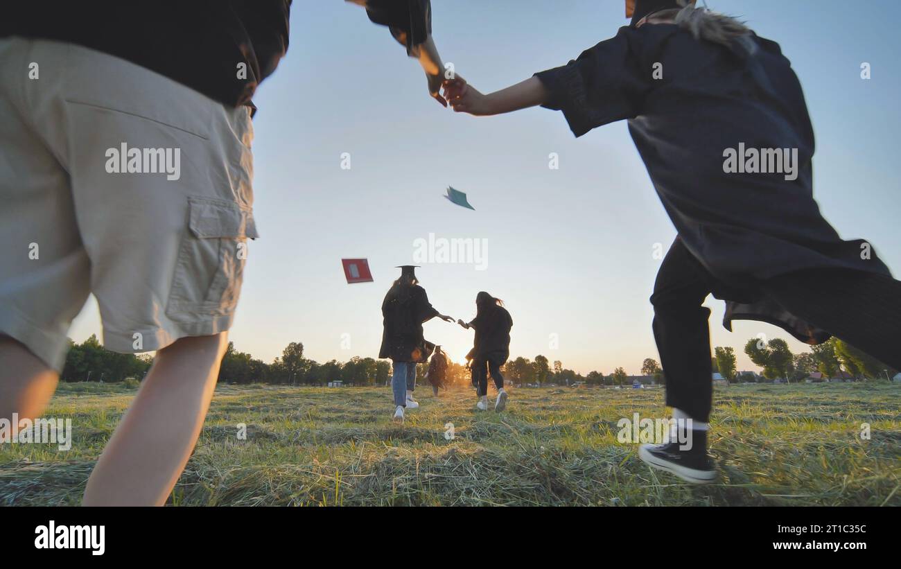 Students throwing books up hi-res stock photography and images - Alamy