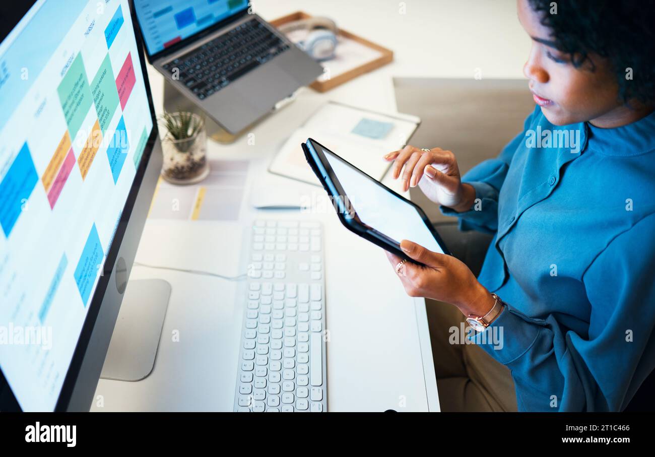 Woman with computer, notebook and schedule in office, agenda and ...