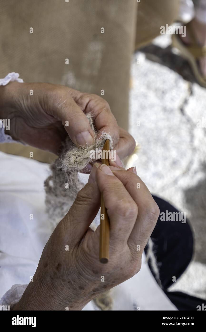 Detail of woman weaving wool in a traditional way with her hands Stock ...