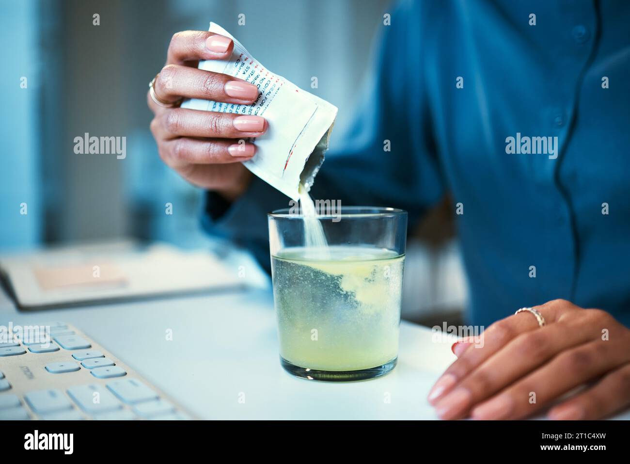 Medicine, water and business person with effervescent in office for ...
