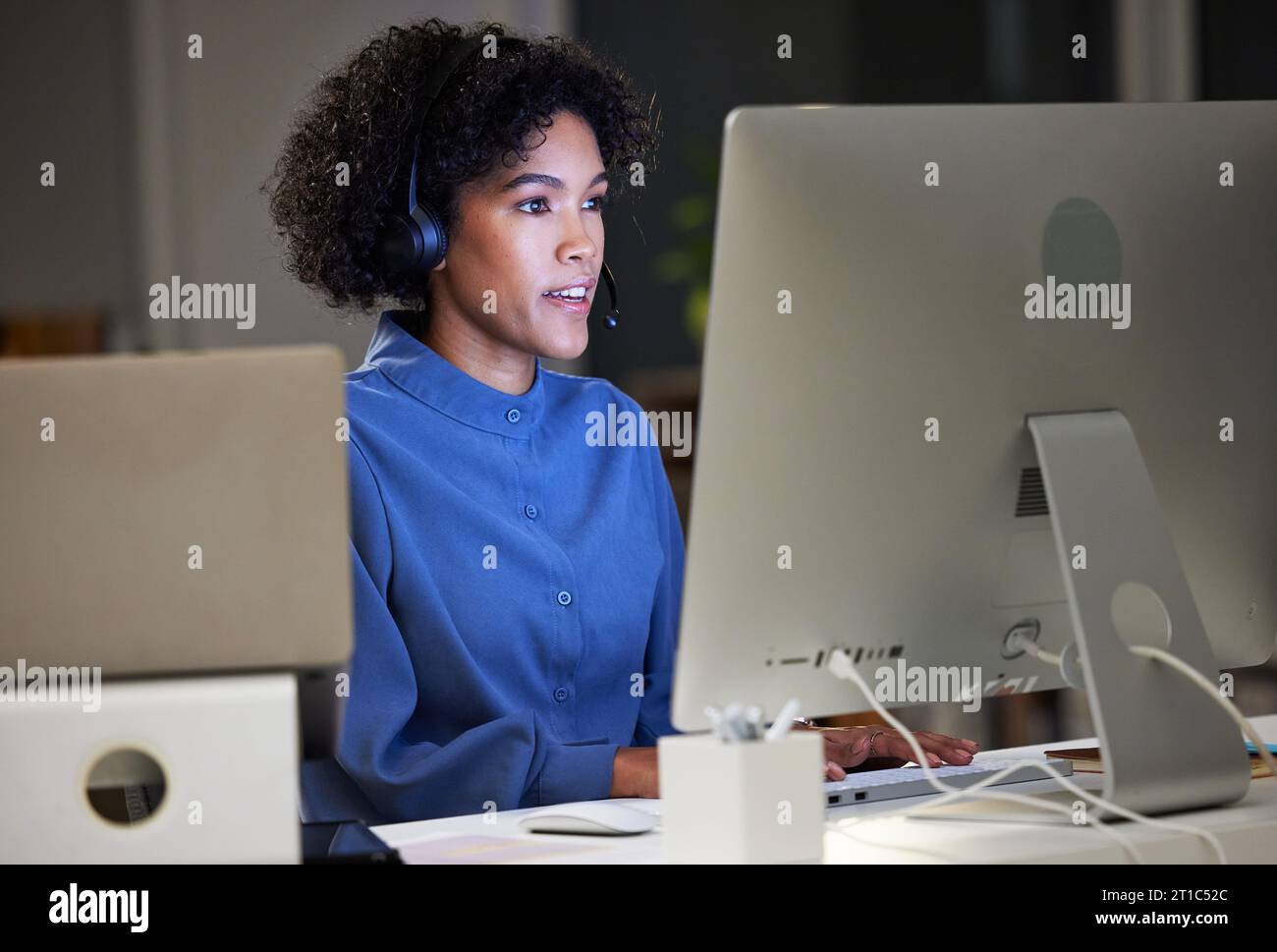 Computer, call center and night business woman typing customer service ...