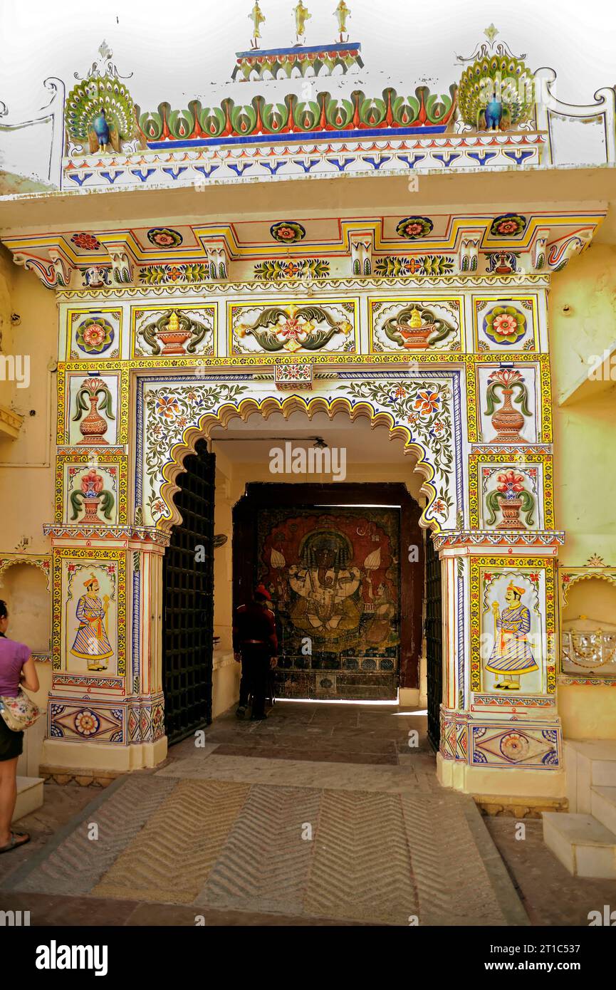 Decorative gate with mural paintings at Udaipur City Palace state ...